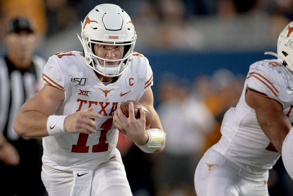 Photos: Sam Ehlinger holds up 'Hook ‘Em Horns' after Texas' win over ...
